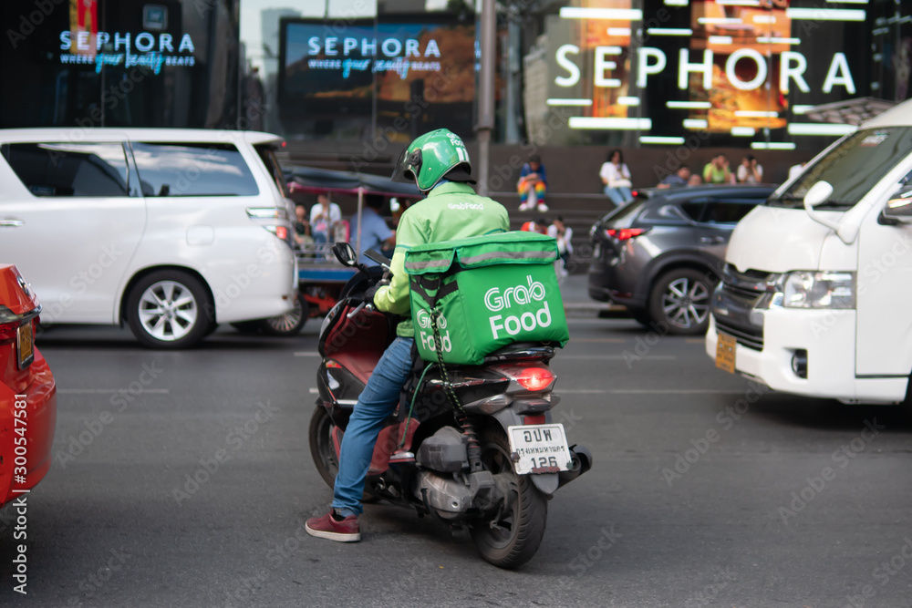 Grab food rider delivering food at Siam Square, Bangkok. Stock Photo ...