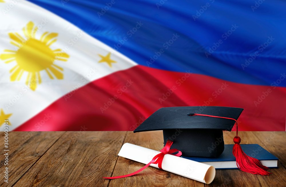 Philippines education concept. Graduation cap and diploma on wooden ...