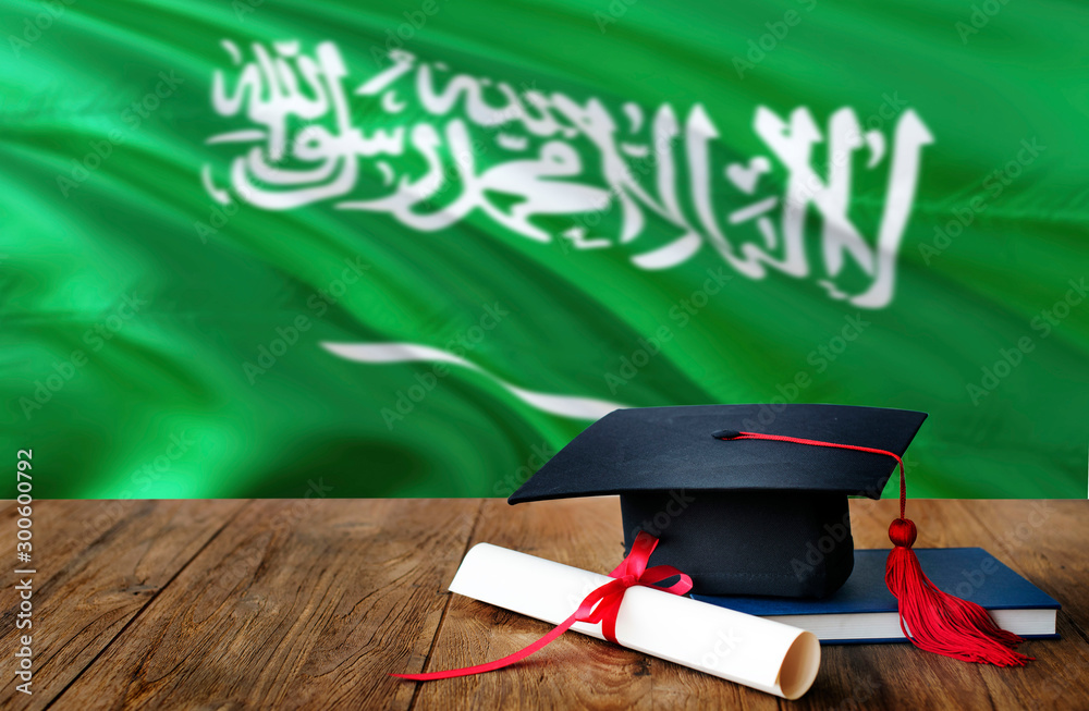 Saudi Arabia education concept. Graduation cap and diploma on wooden ...