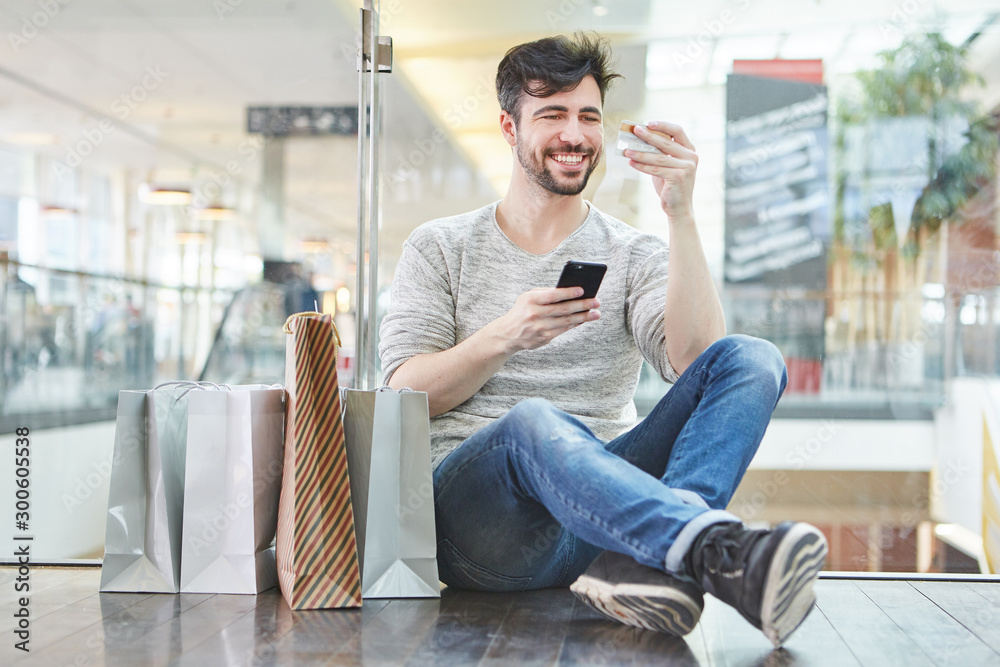 Young man shopping online Stock Photo | Adobe Stock