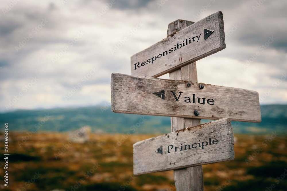 Responsibility, value, principle signpost in nature. Wooden boards ...