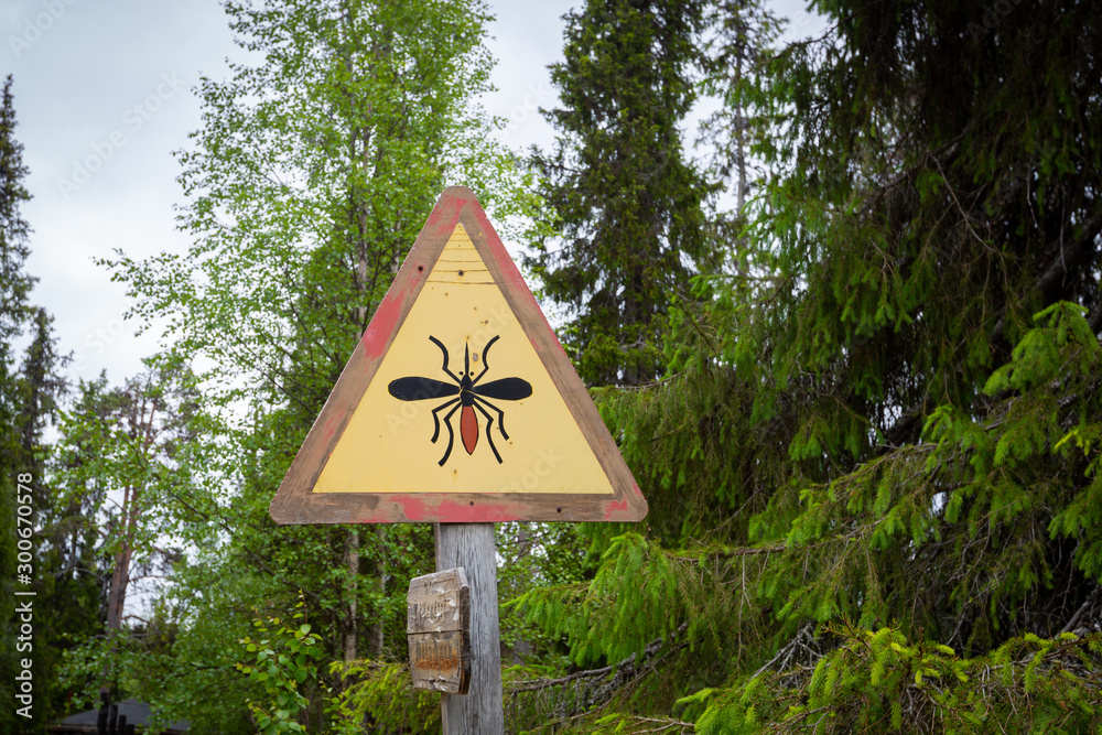 Mosquito area warning sign in forest. A symbol mosquito danger sign ...