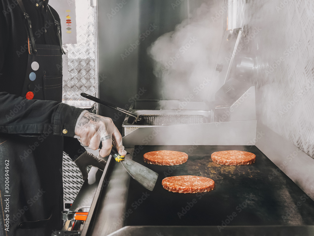 Burger making Close-up photo Unrecognizable cook in black uniform is ...
