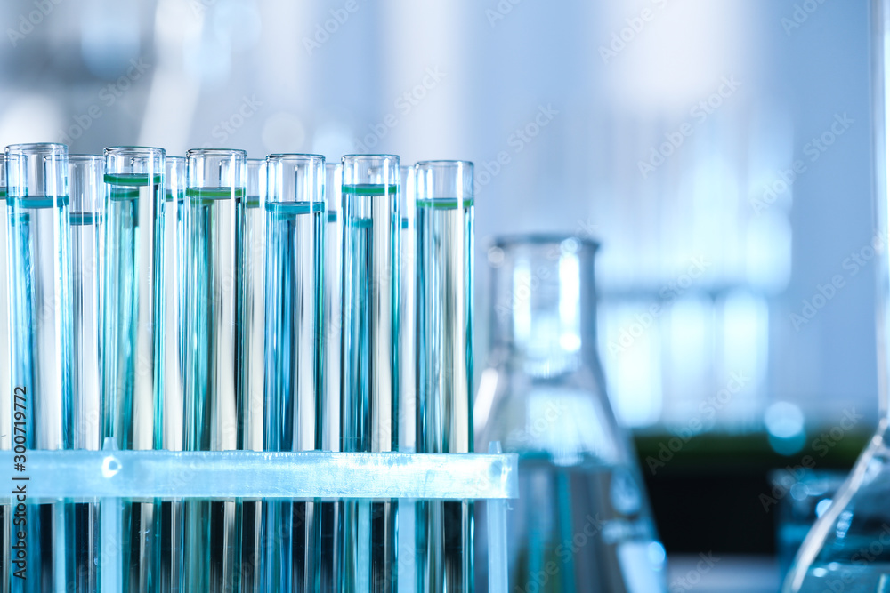 Test tubes with liquid samples for analysis in laboratory, closeup ...