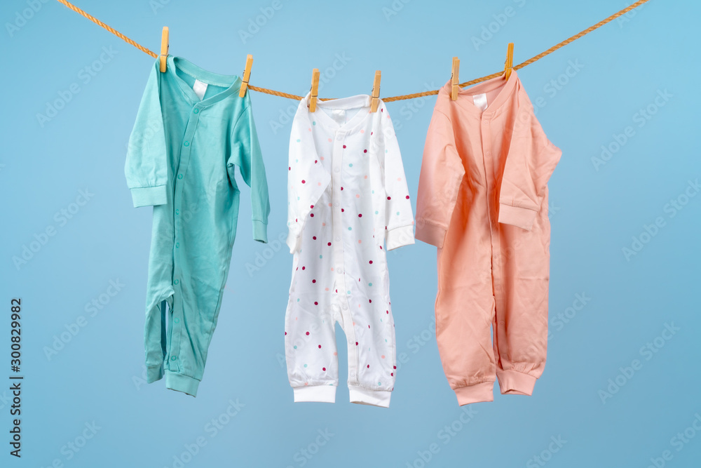 Cute toddler colorful clothing hang on a rope Stock Photo | Adobe Stock