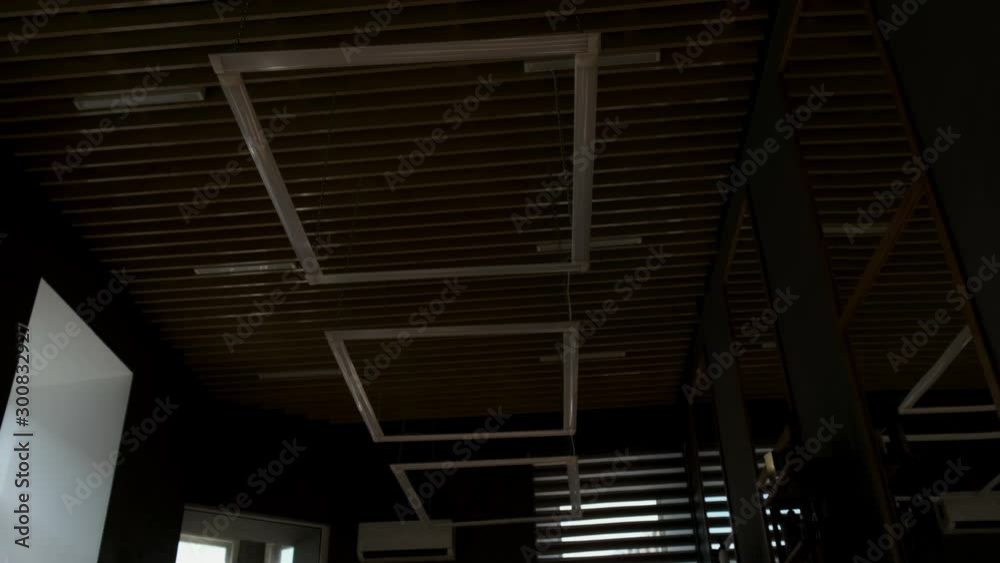 Decorations under the modern ceiling. Linear neon light bulb with ...