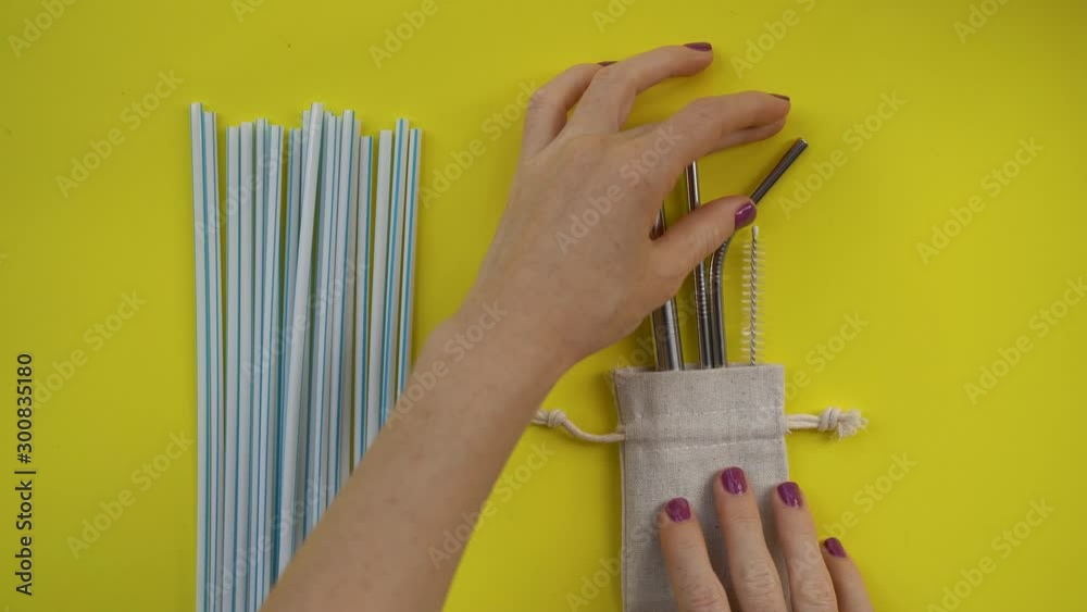Lots of plastic drinking straws and a bag with set of three stainless ...