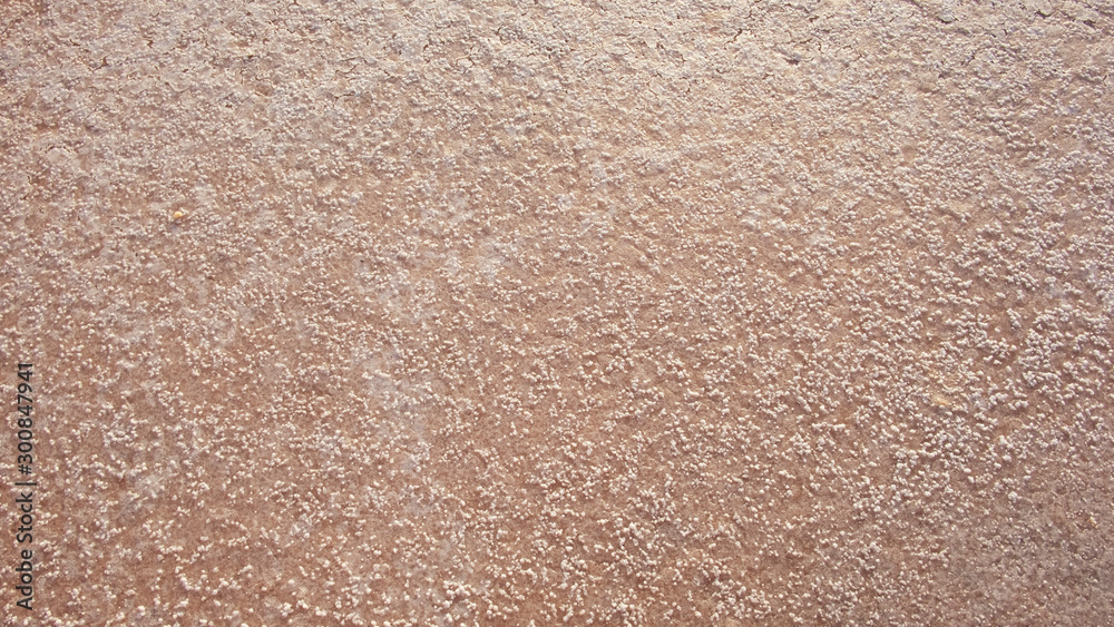 Pink salt crystals background; salt bed surface where crystallization ...