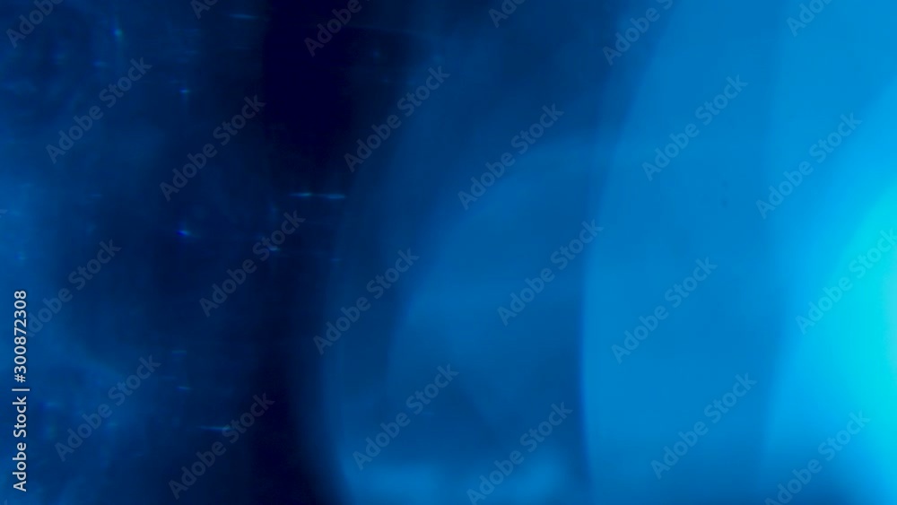 Blue light effect with glow flares over black background Stock Video ...