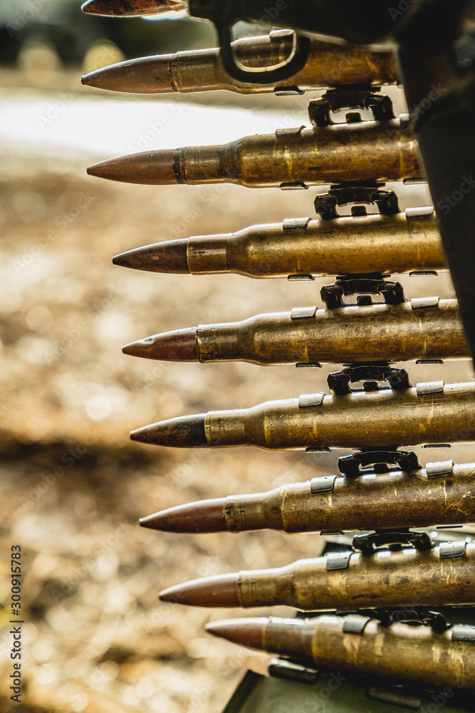 Machine gun bullets. Big long bullets. Military concept. Weapon Stock ...