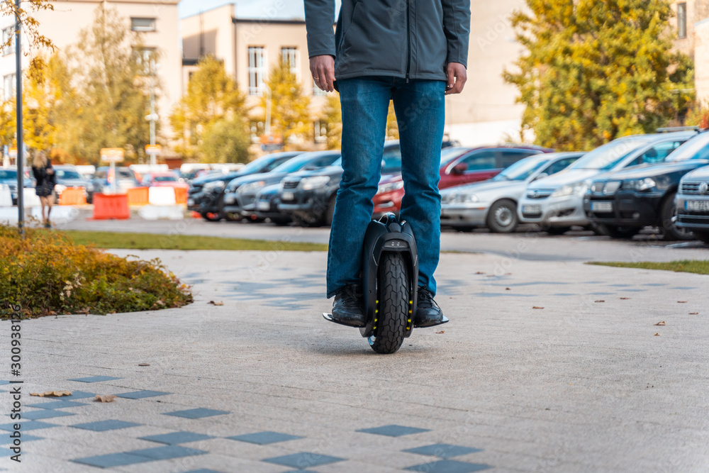 Man Riding On Electric Unicycle On Street, Personal Electric Transport ...