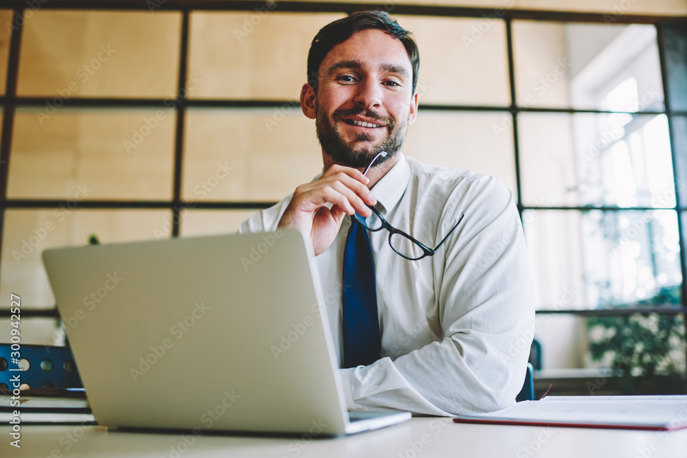 Half length portrait of successful male IT professional developing new ...