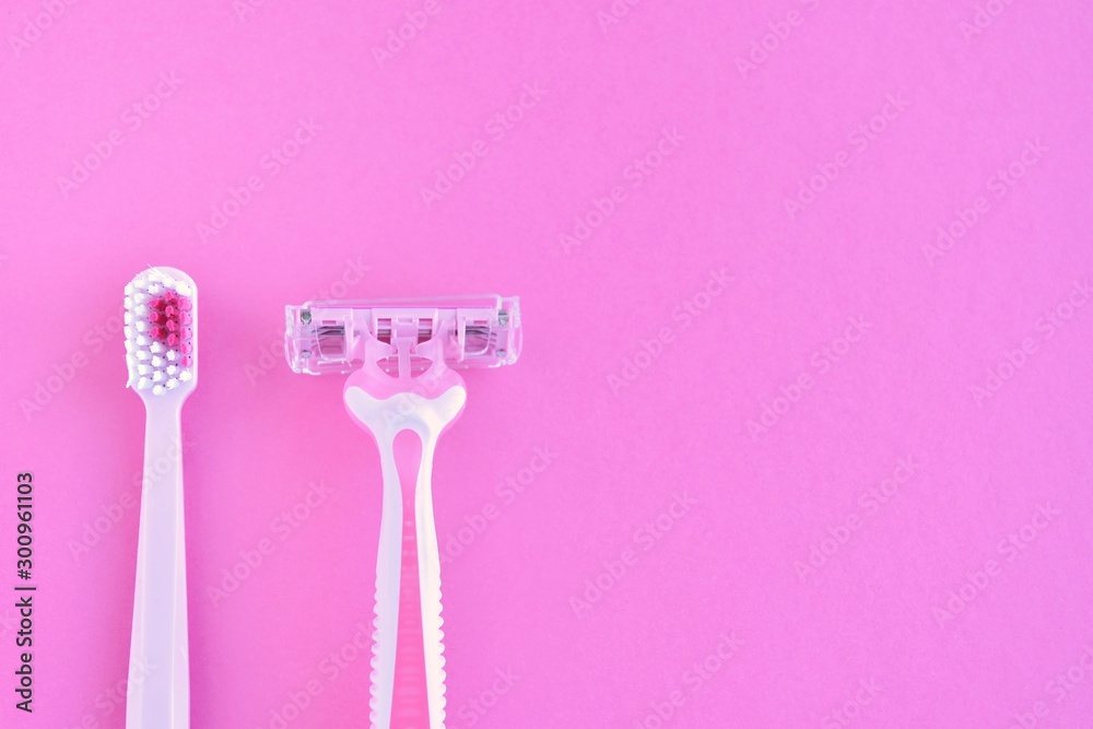 pink disposable razor for safe shaving of female skin and toothbrush ...
