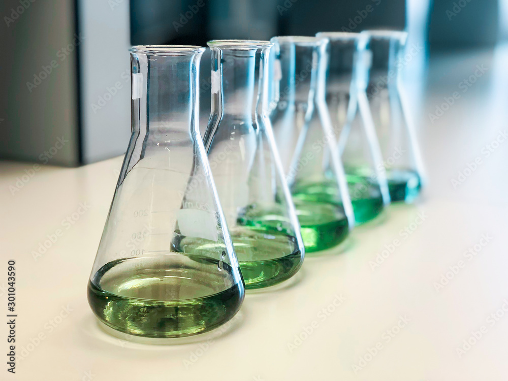 Poster The Erlenmeyer or Conical flasks on bench laboratory, with range ...
