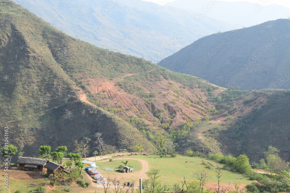 Scenery of beautiful Nepali rural village with mountains and green ...