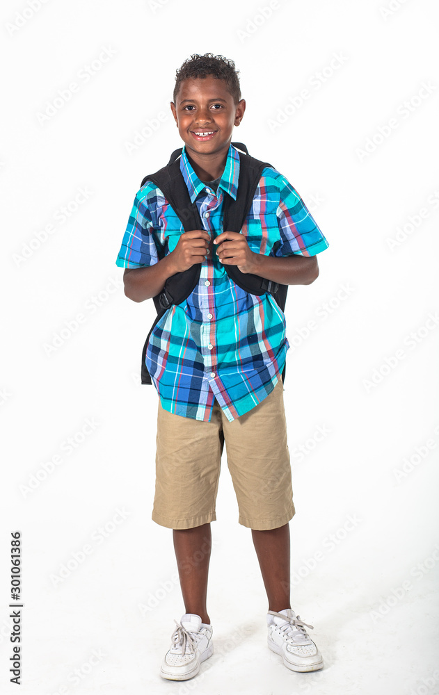 Smiling African American school boy isolated on white background ...