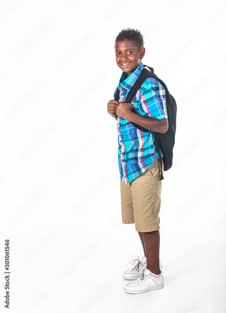 Smiling African American school boy on white background. Wearing a ...