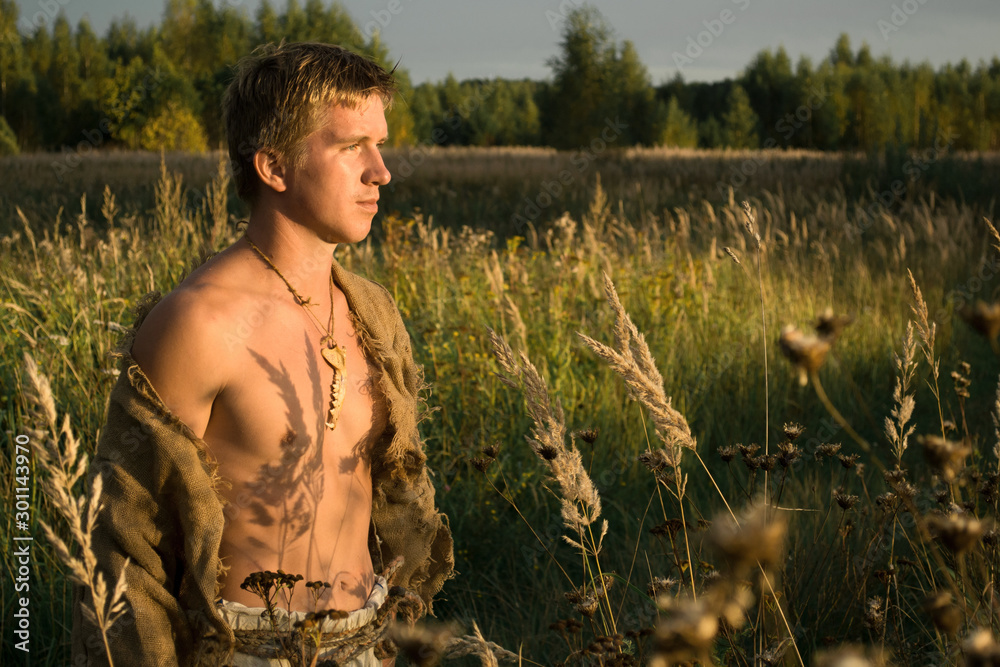 Downshifting concept - medieval peasant in a ragged clothes ...