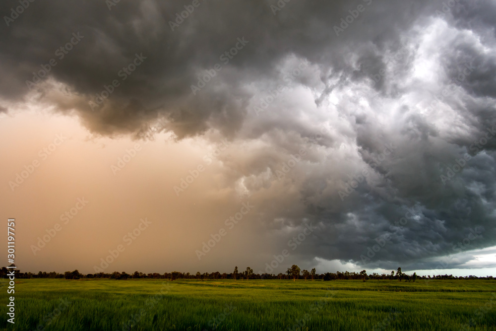 Dark sky and dramatic black cloud before rain.A tropical cyclone is a ...
