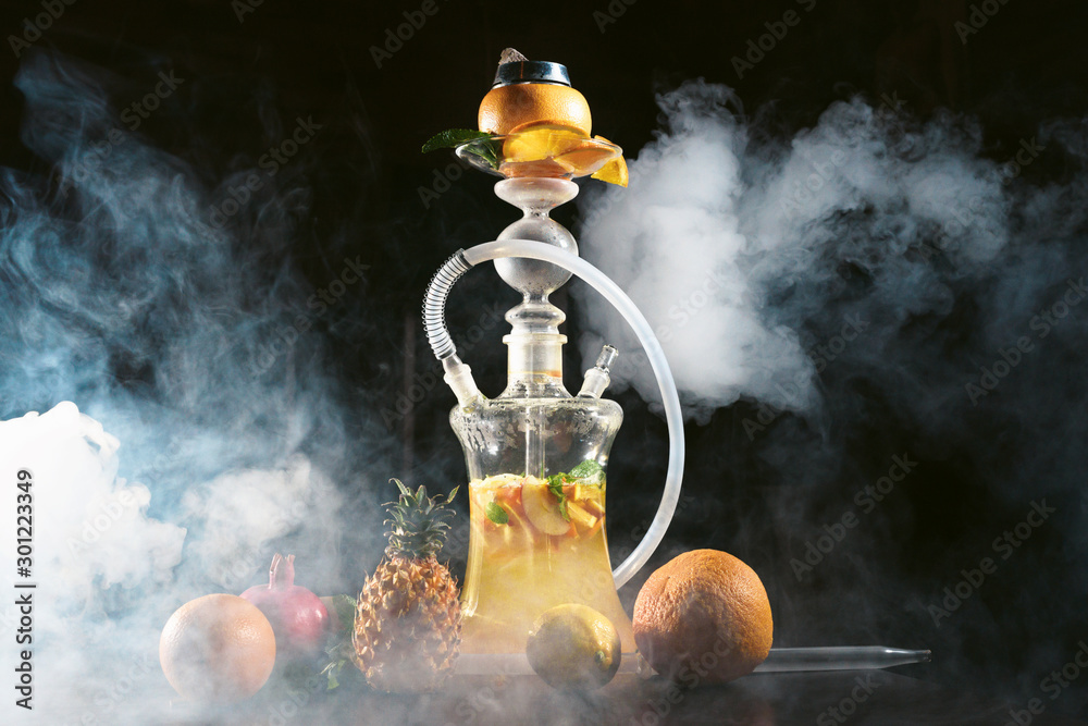 Beautiful traditional glass shisha hookah with grapefruit bowl and ...