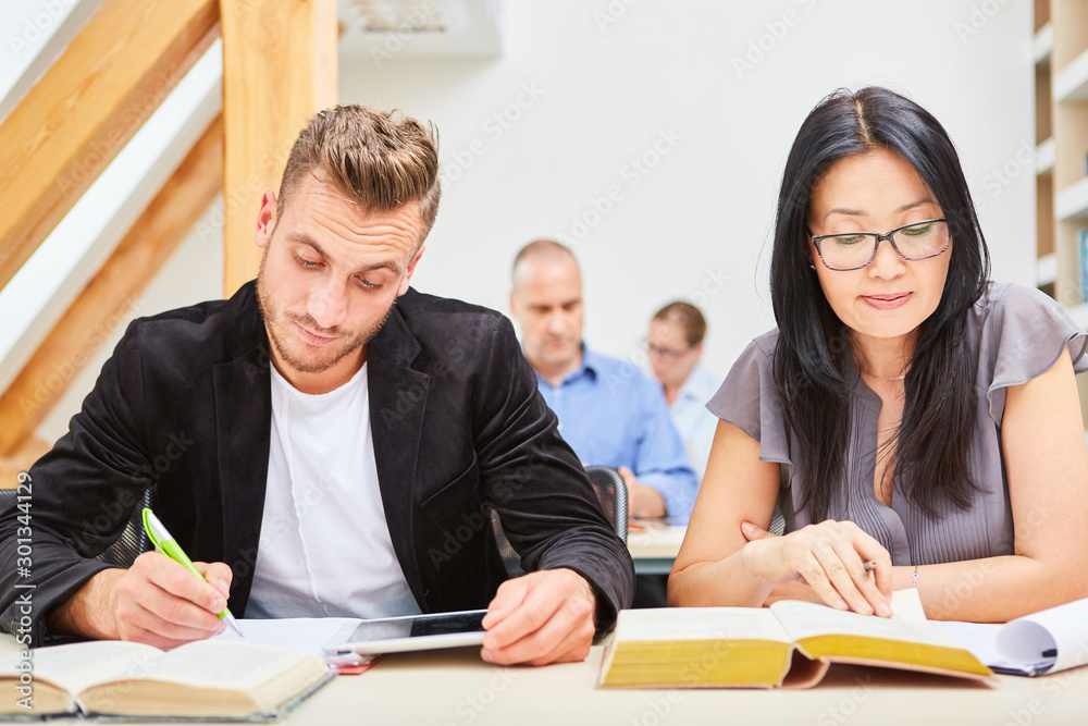 Group of students in learning in a seminar Stock Photo | Adobe Stock