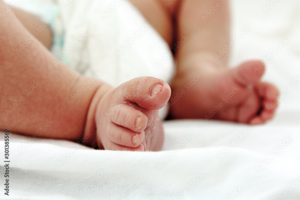 Newborn baby feet. Maternity hospital, perinatal center, motherhood ...