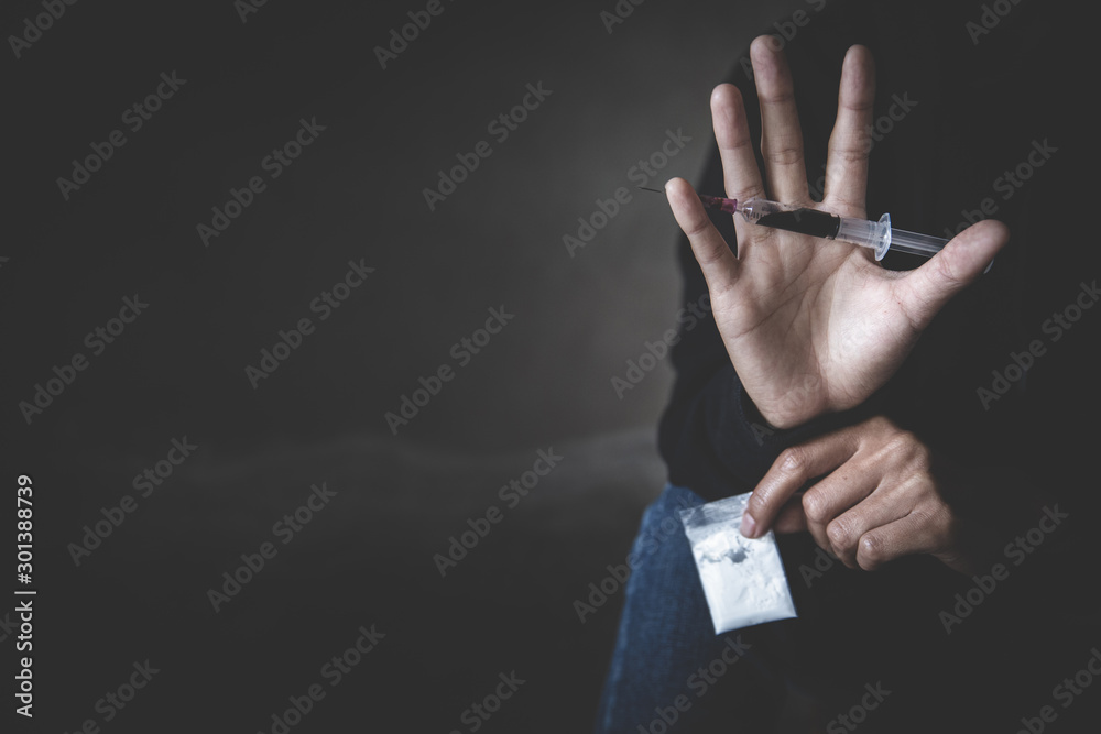 Drug addict young woman with syringe in action, Stop drug addiction ...