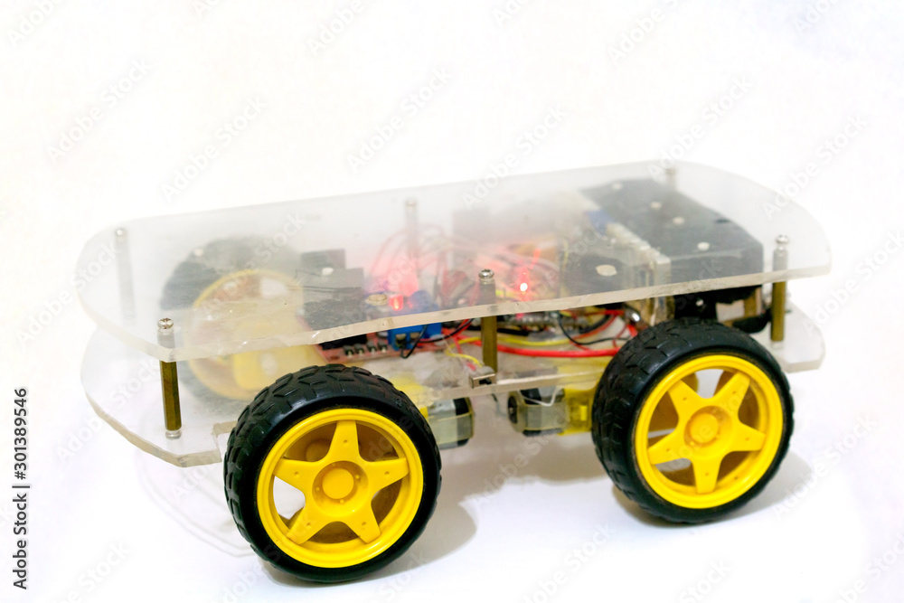 Handmade remote control car made from transparent plastic plate. Craft ...