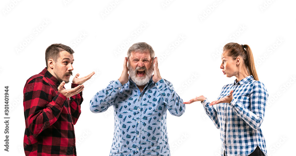 Family members arguing with one another on white studio background ...