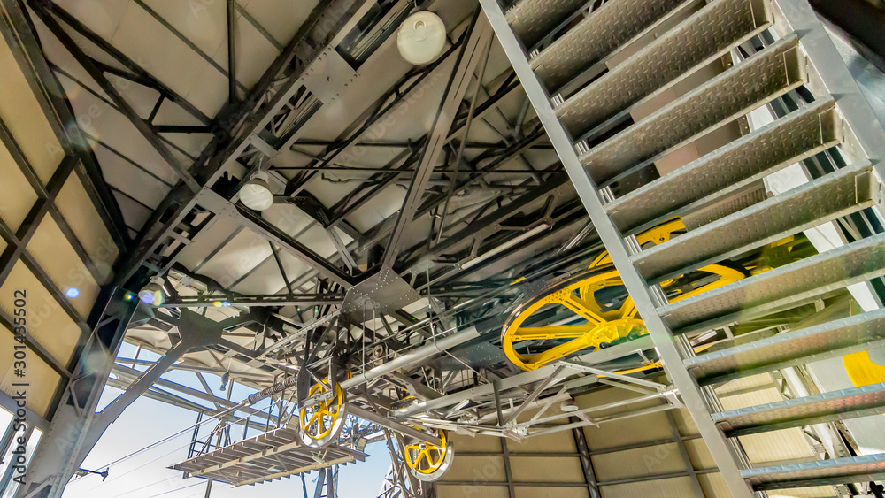 Drive system, pulleys and yellow wheels on the roof on the overhead ...