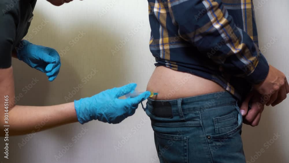 Antibiotic injection in male buttocks Stock ビデオ | Adobe Stock