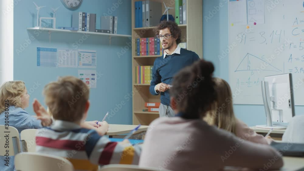 Enthusiastic Teacher Explains Lesson to a Classroom Full of Bright ...