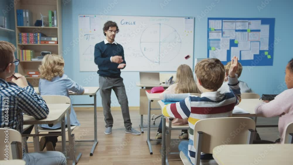 Zoom Out Portrait of Teacher Explaining Lesson to Classroom Full of ...