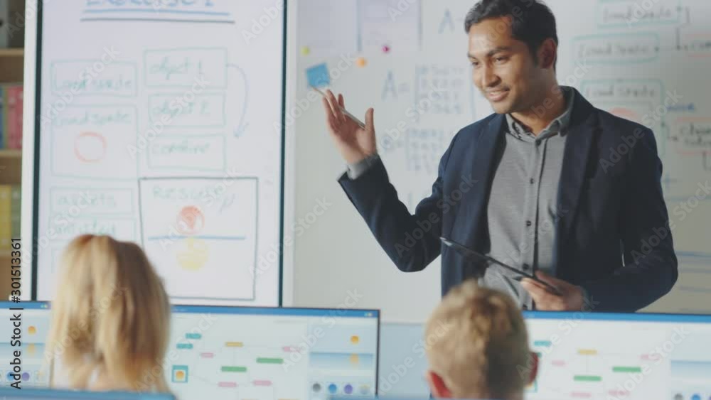 Vídeo do Stock: Elementary School Class: Teacher Uses Interactive ...