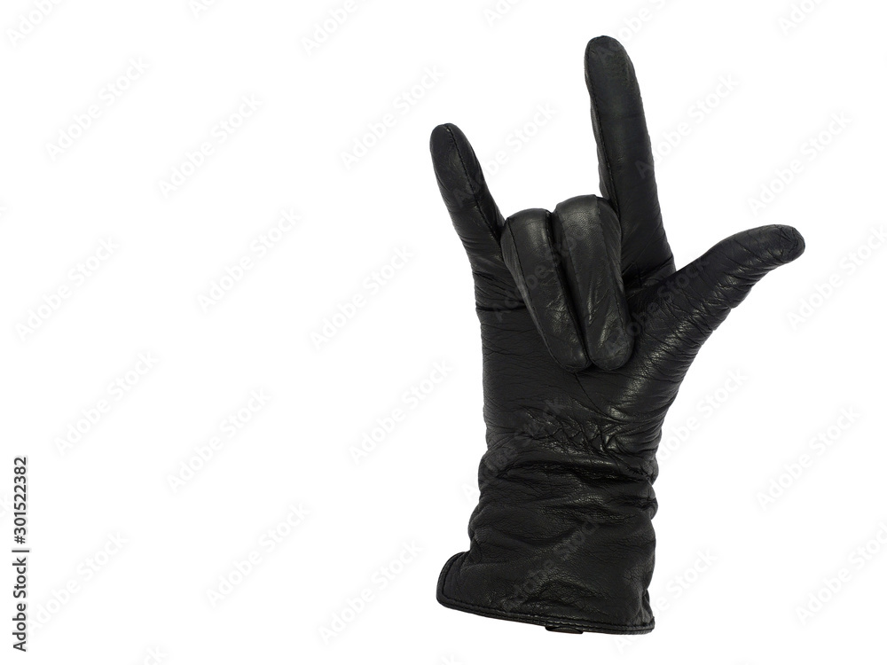 Hand in slightly worn black leather glove shows goat sign, devil horns ...
