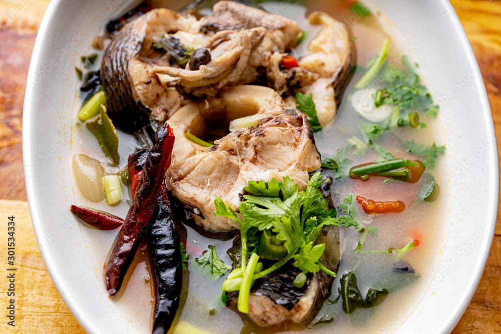 Tom Yum Snakehead Fish,Tom Yum Snakehead fish on Thai tableware In a ...