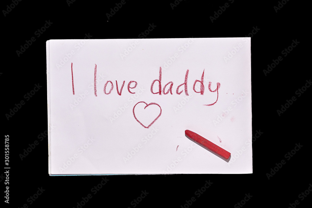 child write a letter on her drawing book by red crayon to her father ...