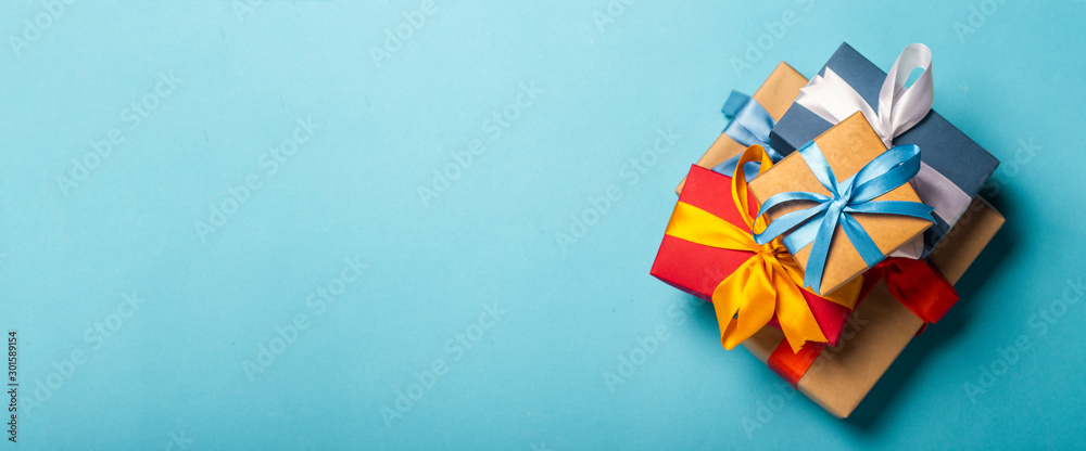 Stack of gifts on a blue background. Gift concept for a loved one ...