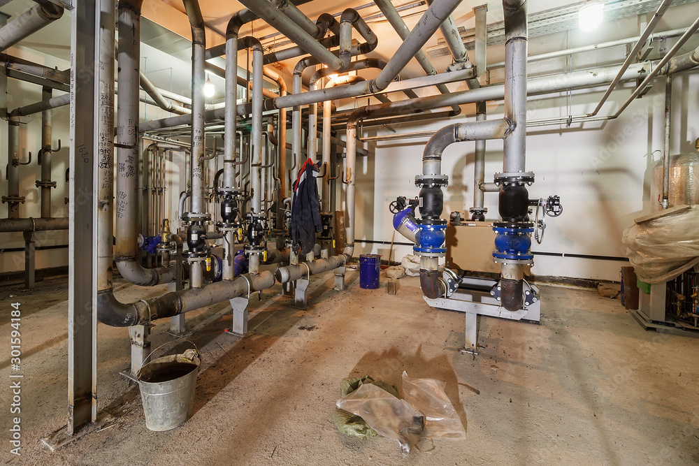 pumping station under construction. pipes of central heating system and ...