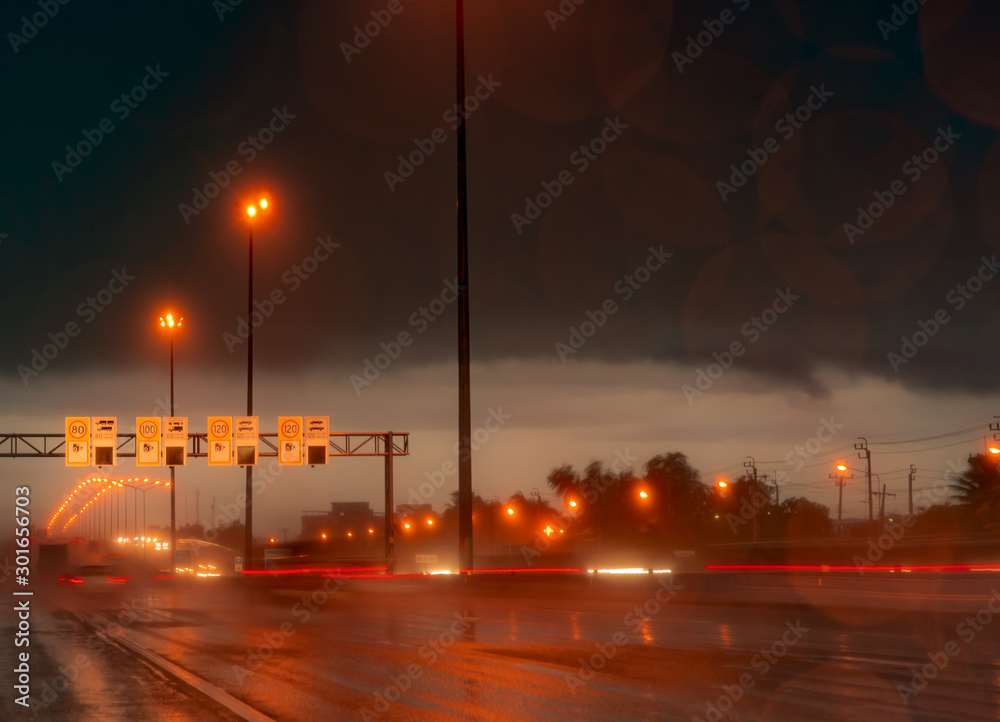 Street light at night in rainy day. Car and truck on asphalt road. Dark ...