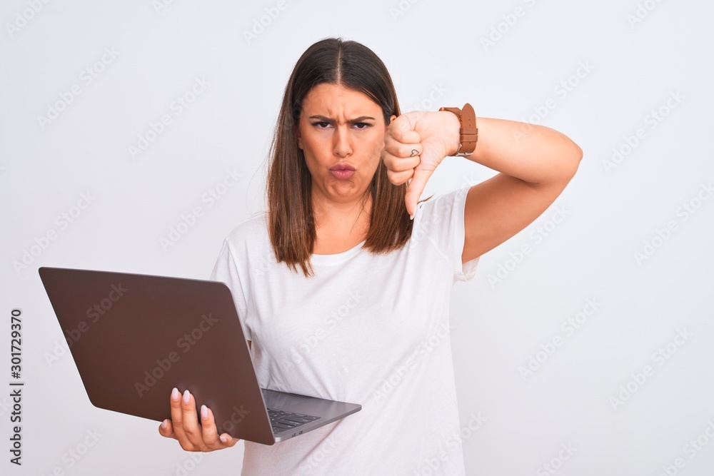 Beautiful young woman working using computer laptop over white ...