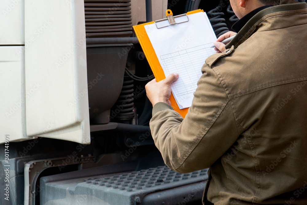 Truck Driver is Checking the Semi Truck's Maintenance Checklist ...
