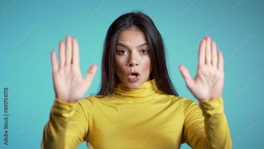 Angry annoyed woman raising hand up to say no stop. Sceptical and ...