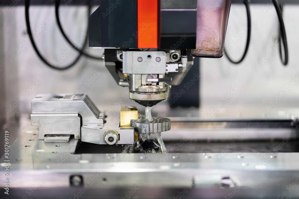High precision CNC wire cut machine working, operator machining die ...
