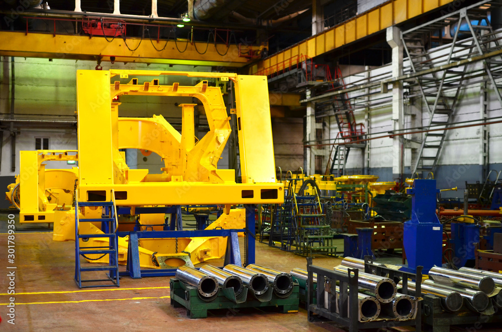 Production process of heavy mining trucks at the factory. Dump truck on ...