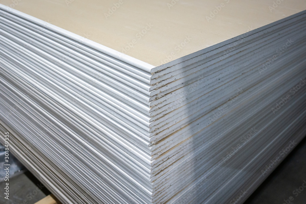 Drywall stack. Gypsum boards sheets for construction Stock Photo ...