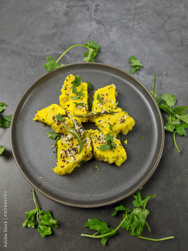 Overhead view of Dhokla, an Indian Gujarati snack which is vegetarian ...