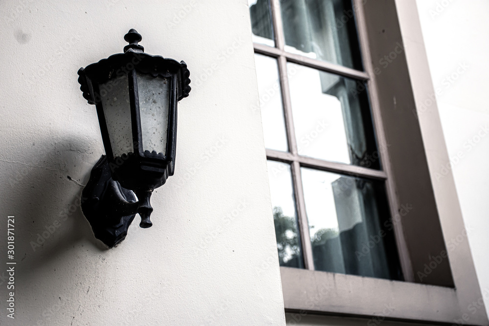 Dirty lamp by the window of an old house Stock Photo | Adobe Stock