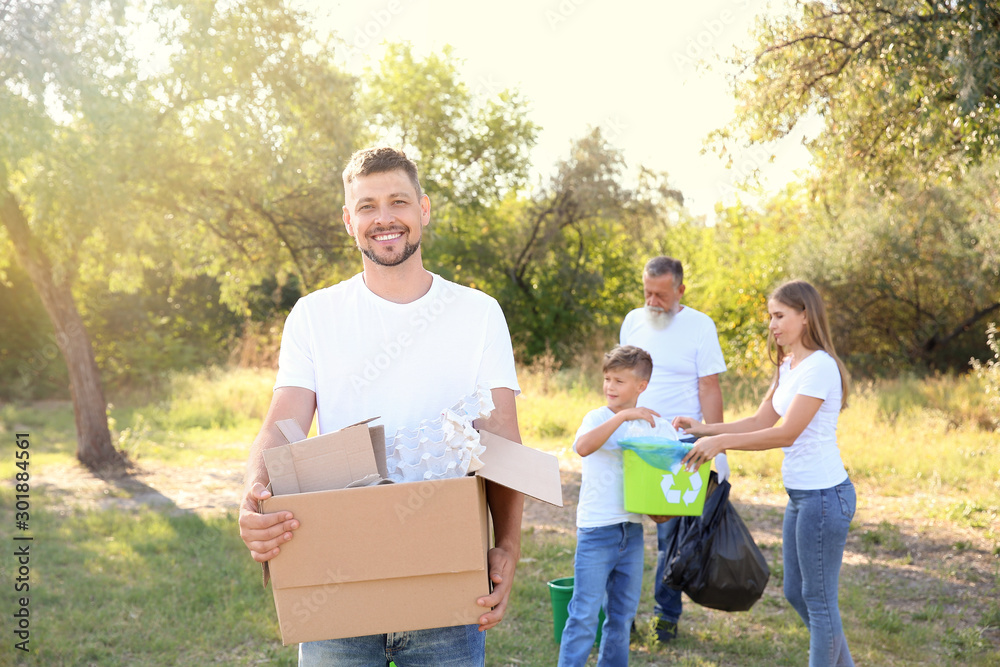 People gathering garbage outdoors. Concept of recycling Stock Photo ...