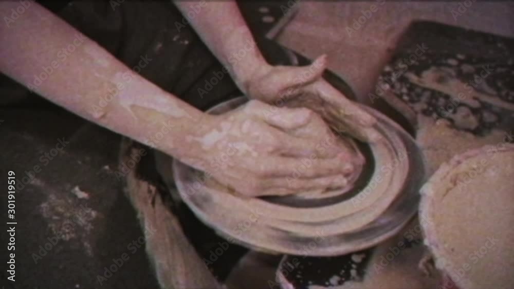 Vintage effect. A potter teaches a woman to make clay dishes. Glitch ...